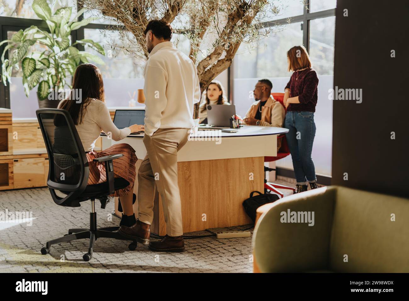 Successful collaboration. Multigenerational team discussing business ...