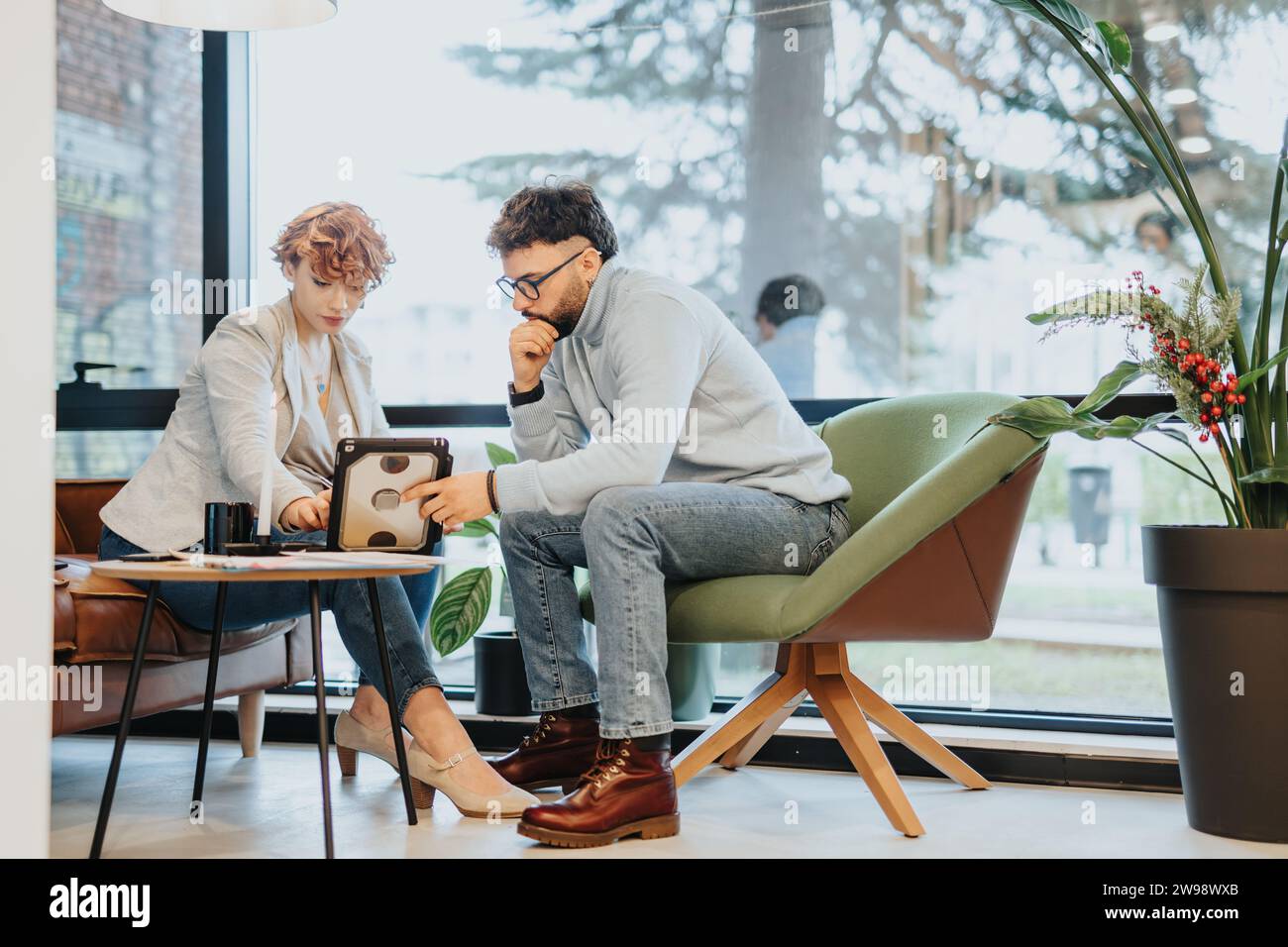 Group of business people collaborating and strategizing in a corporate ...