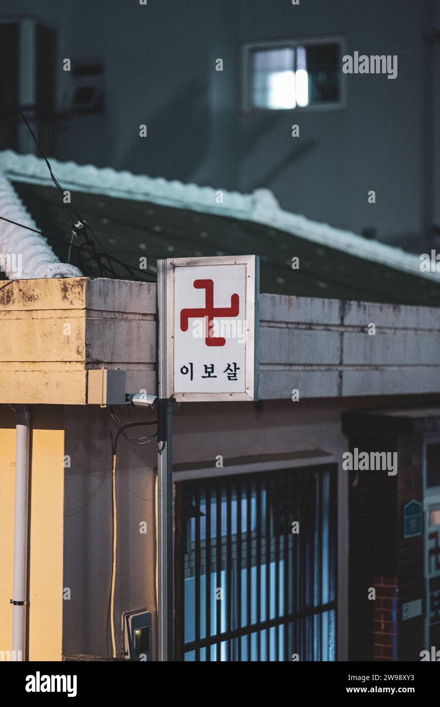 A beautiful nighttime view of a Buddha sign illuminated in the darkness ...