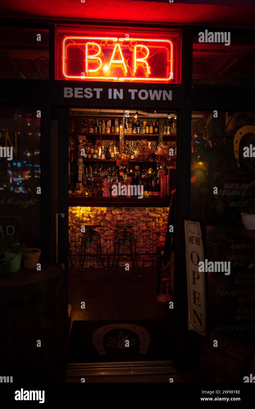 An entrance of a local bar with a sign 'best in town' in Okinawa, Japan ...
