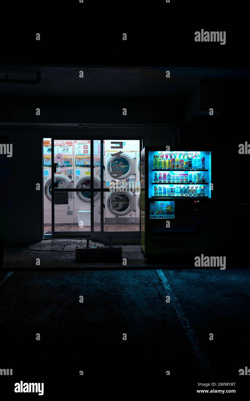 The Japan vending machines outside of a laundromat at night time Stock ...