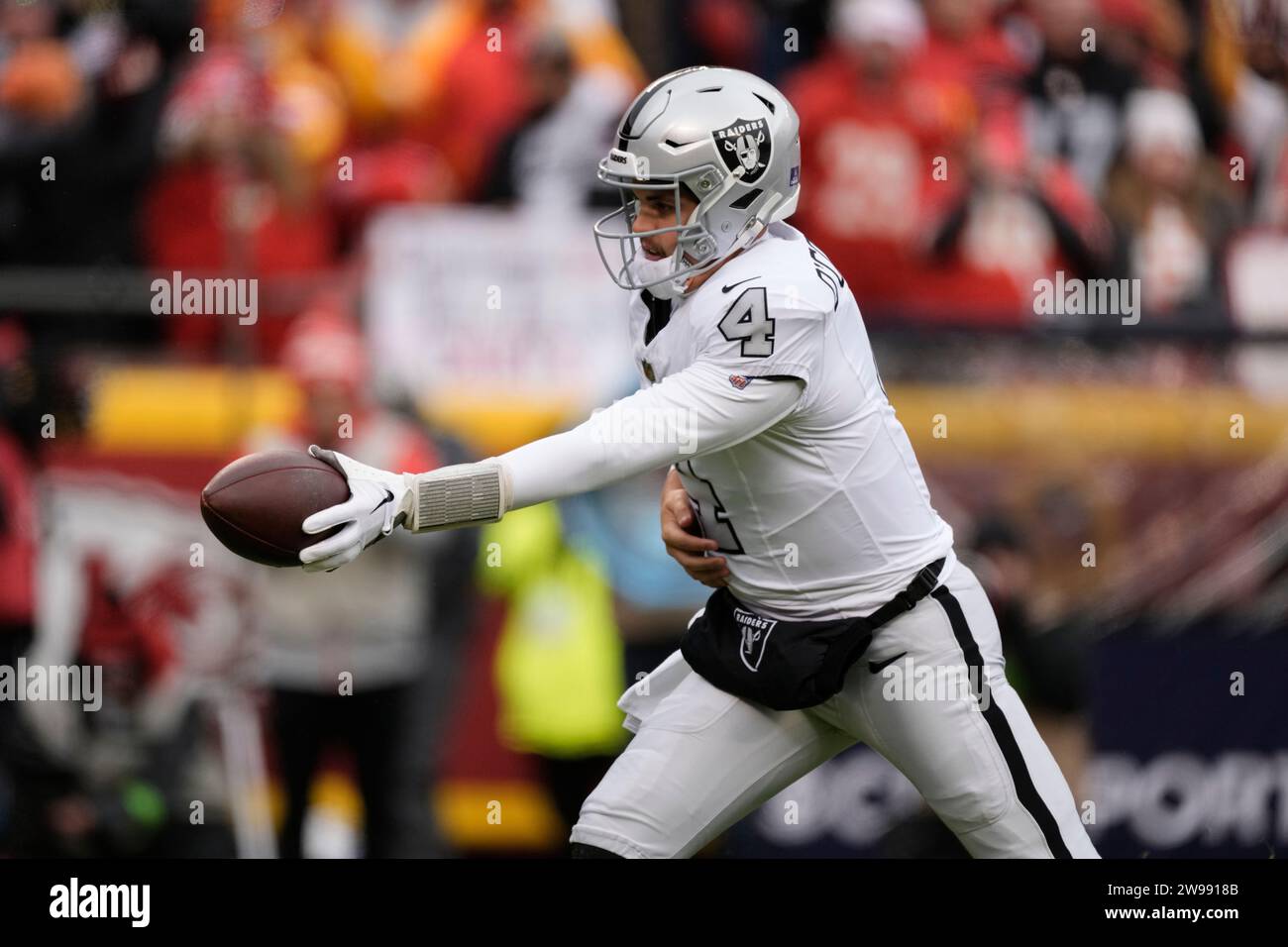 Las Vegas Raiders quarterback Aidan O'Connell hands off during the ...