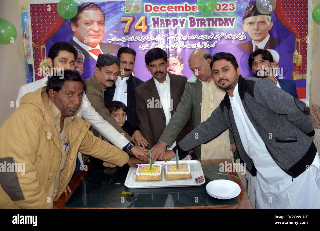 Muslim League (PML-N) District President, Kaleem Shaikh cutting a cake ...