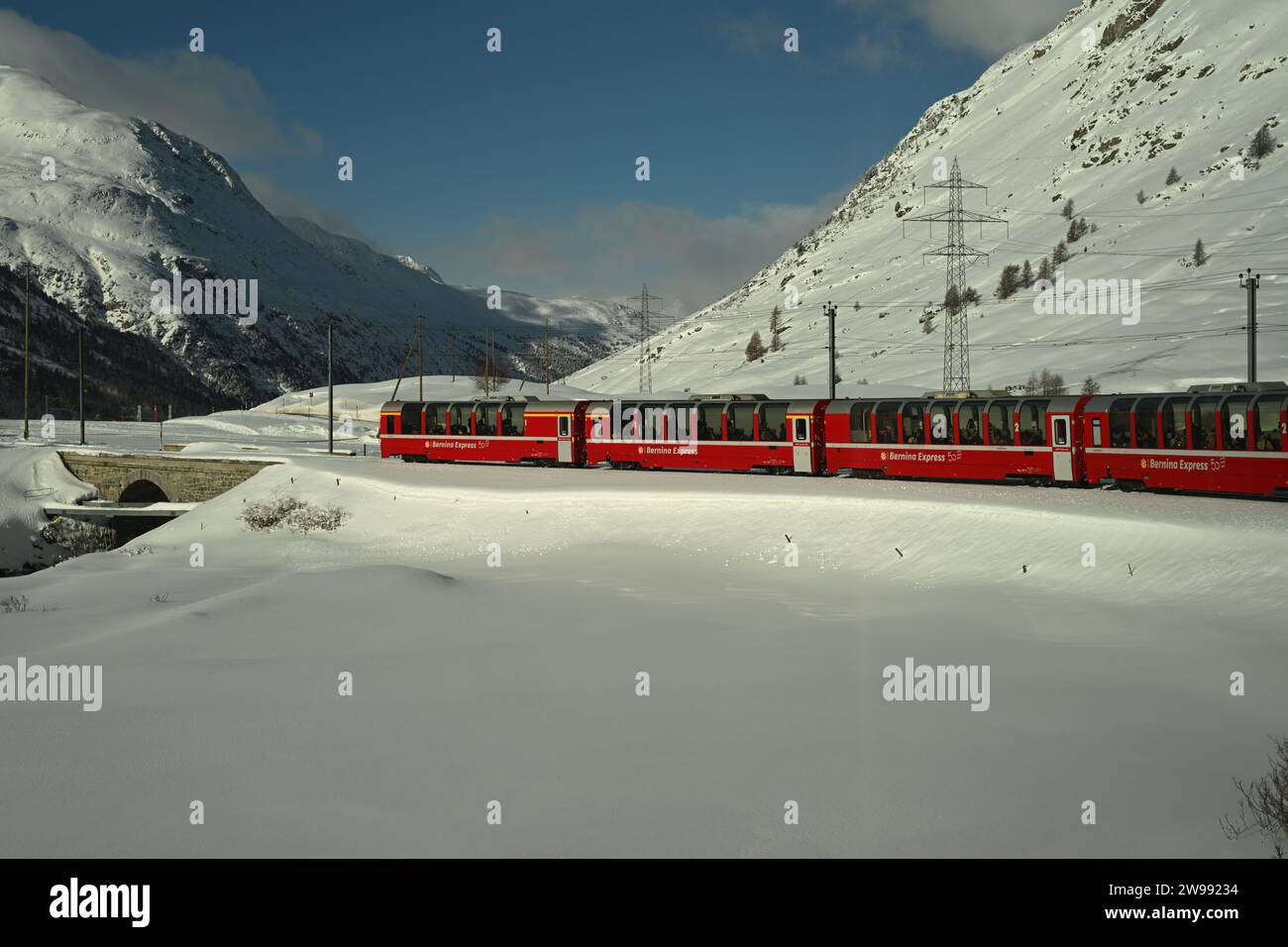 A train ride on the famous Bernina Express in Switzerland going over ...
