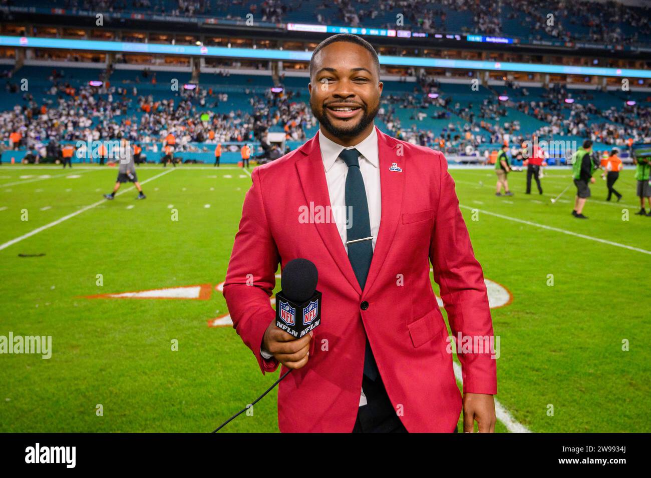 NFL Network reporter Cameron Wolfe smiles on the field after the ...
