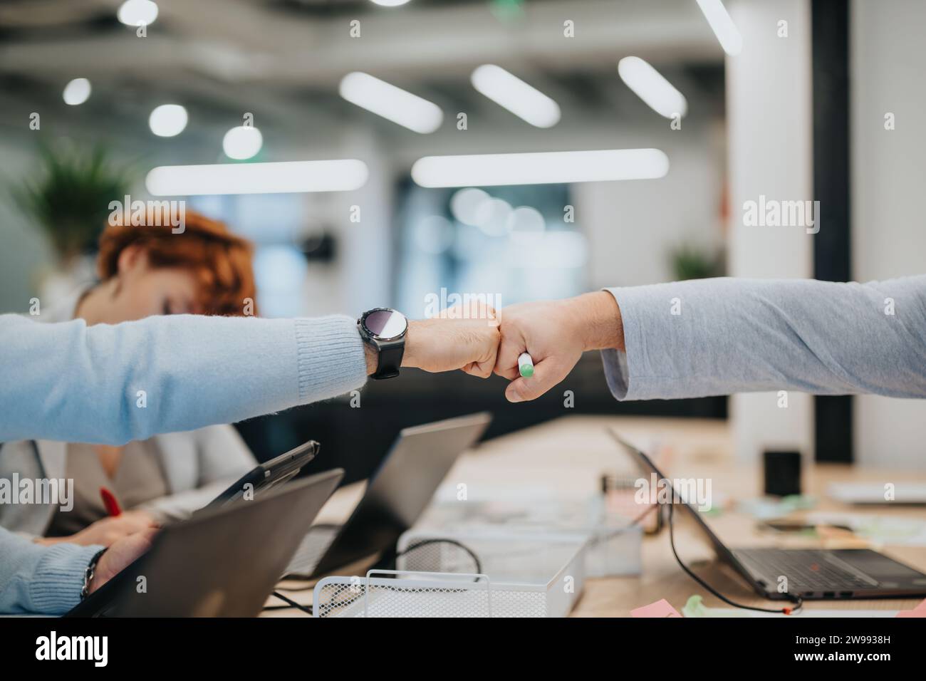 Fist bump concept. Colleagues giving fist bump. Bumping fists. Teamwork ...
