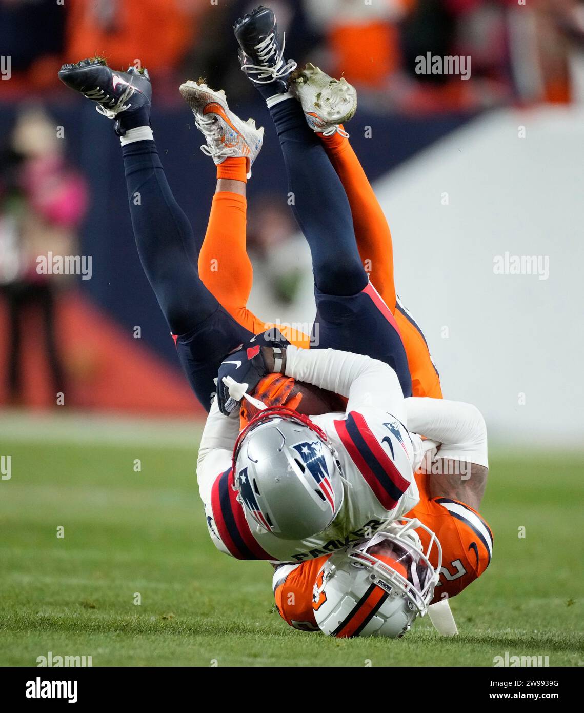 New England Patriots wide receiver DeVante Parker (1) is tackled by Denver Broncos cornerback ...