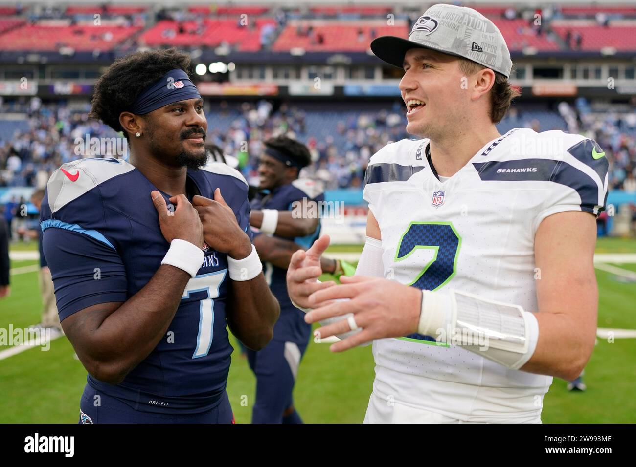 Tennessee Titans quarterback Malik Willis (7) talks to Seattle Seahawks quarterback Drew Lock (2 ...