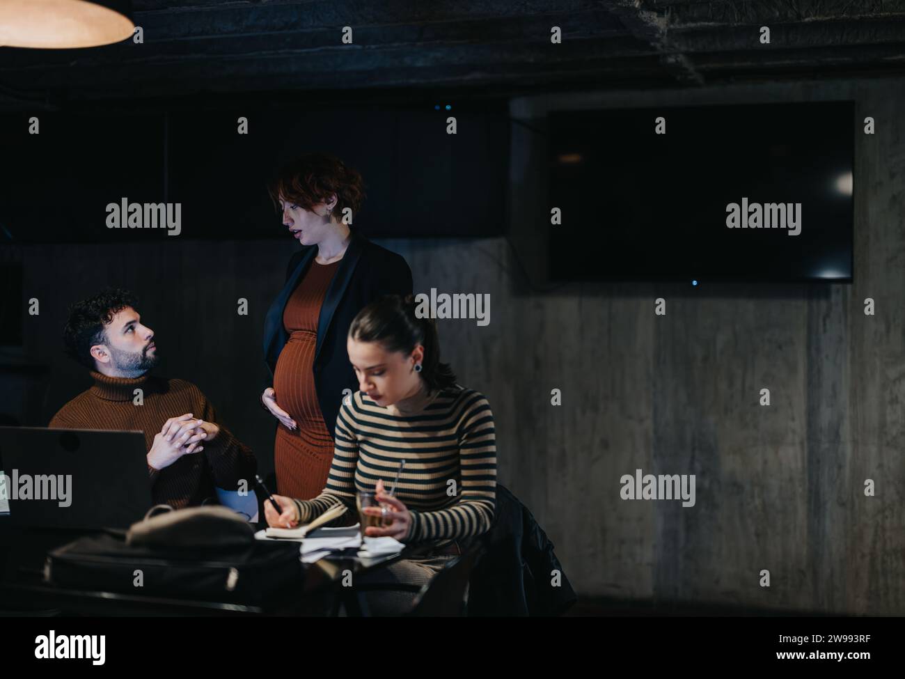 Successful business team analyzing sales statistics in the corporate ...