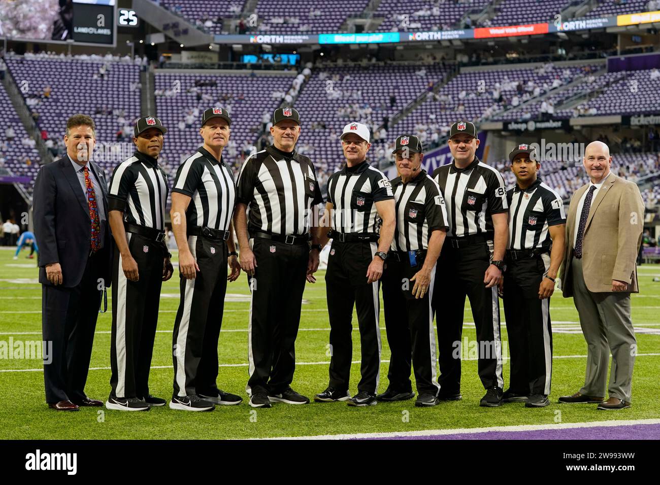 Referees pose for a photo before an NFL football game between the ...