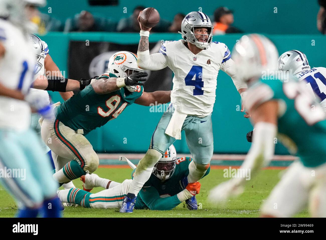 Dallas Cowboys quarterback Dak Prescott (4) is pressured by Miami ...