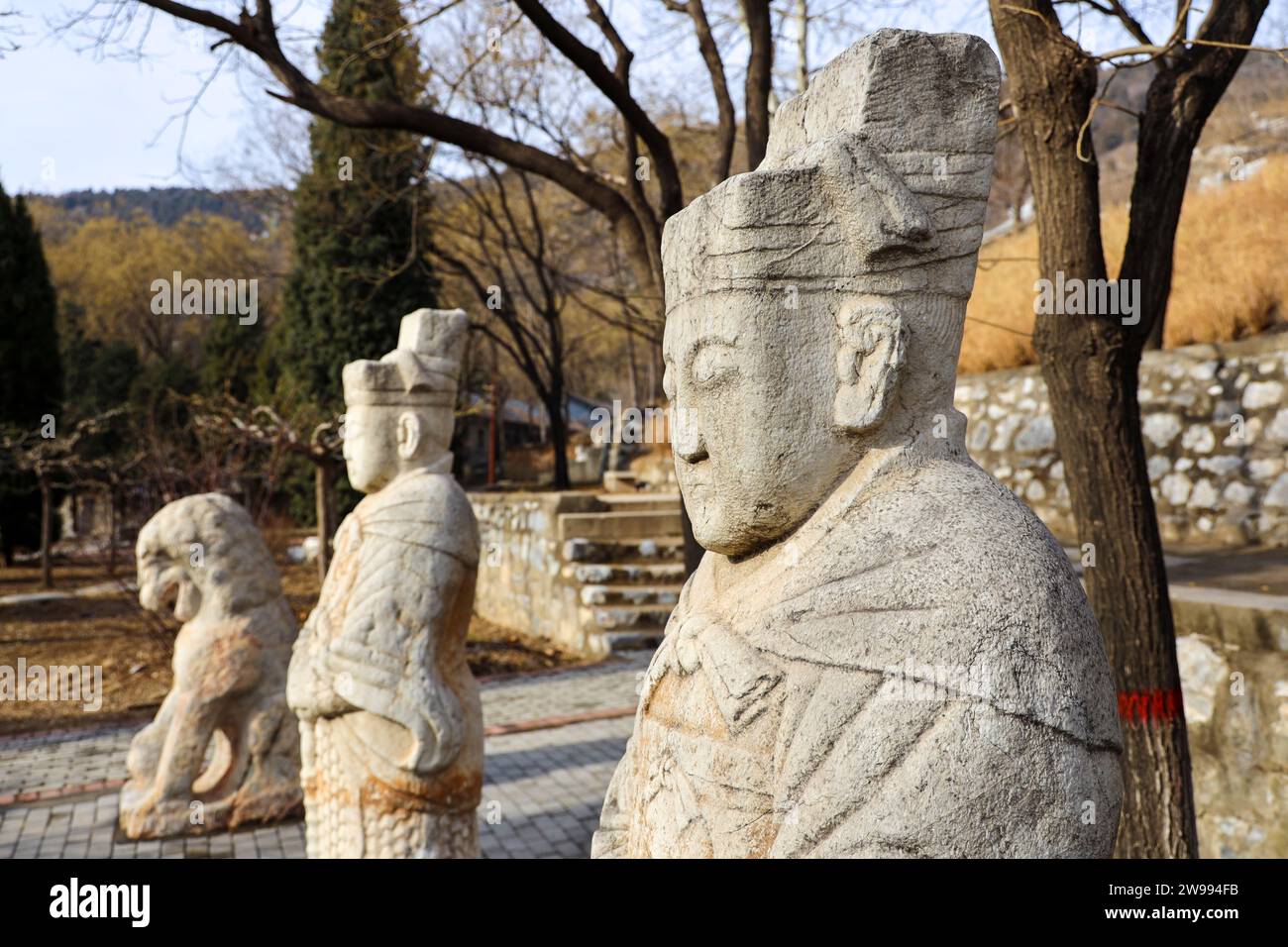 A picturesque outdoor scene featuring a set of grand statues perched ...