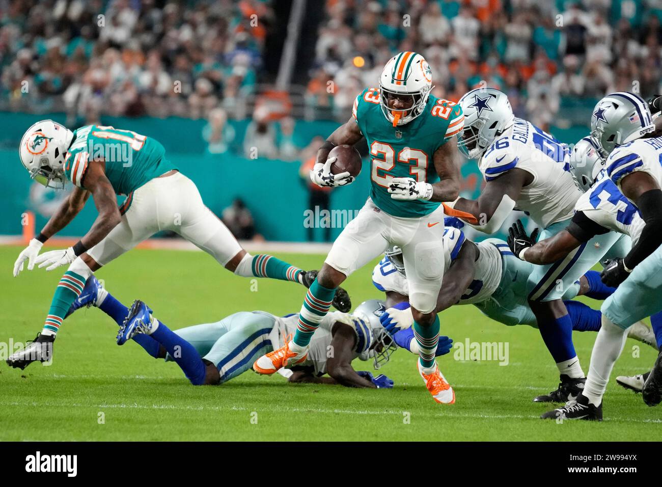 Miami Dolphins running back Jeff Wilson Jr. (23) runs during the second half of an NFL football ...