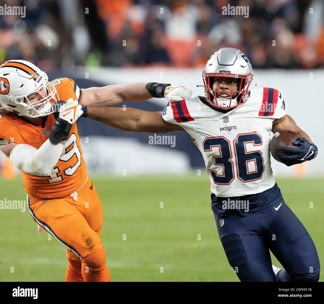 Denver, Colorado, USA. 24th Dec, 2023. Patriots RB KEVIN HARRIS stiff ...