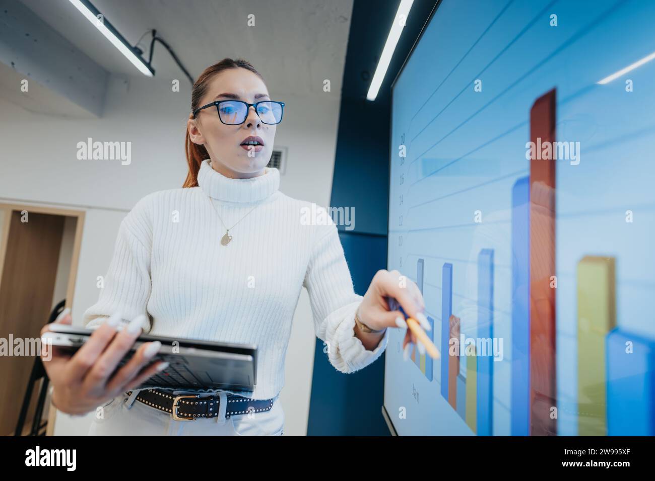 Business lecture in modern classroom. Businesswoman presenting and ...
