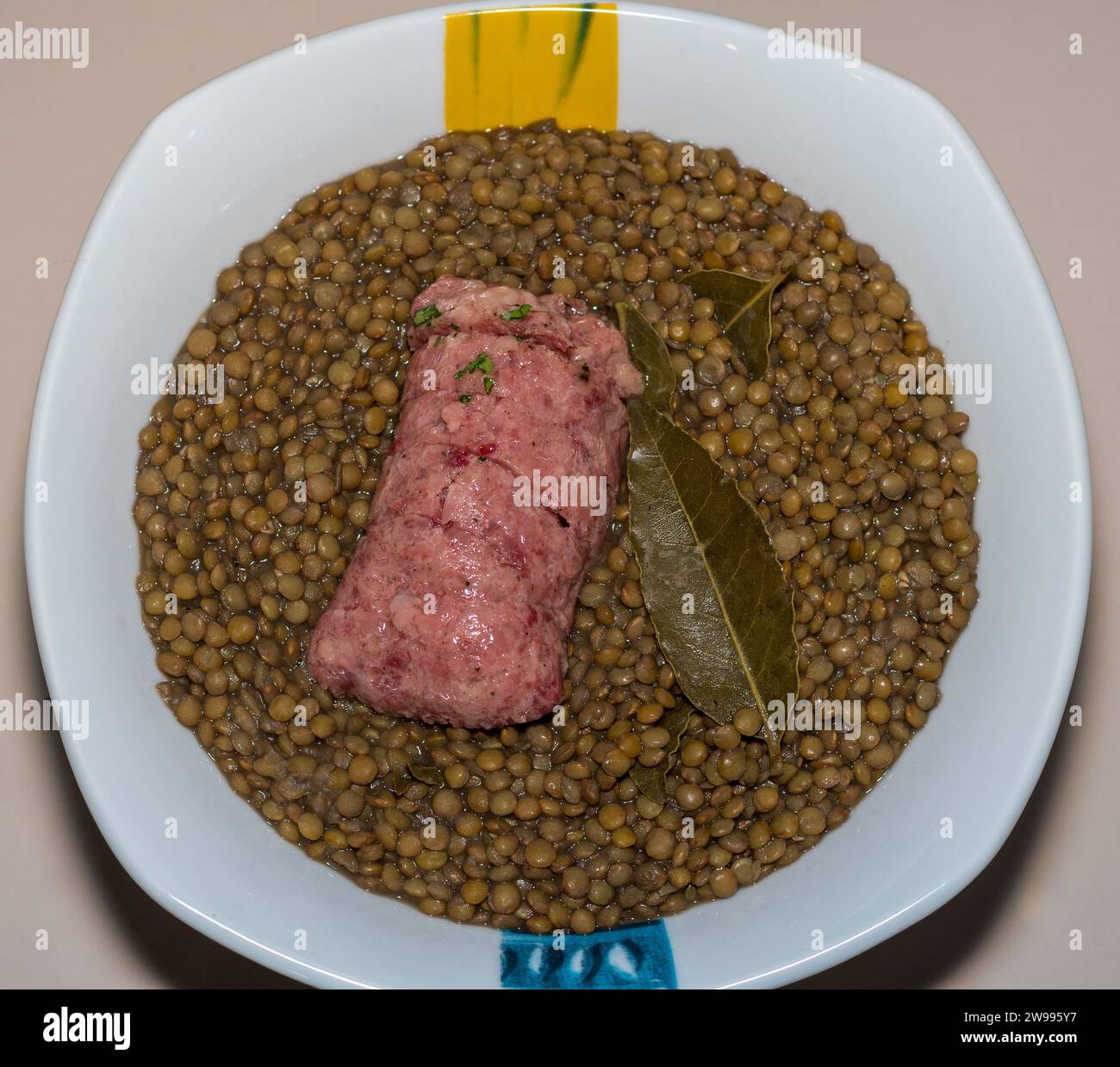 Dish taken from above with Cotechino and lentils, cooked with bay ...