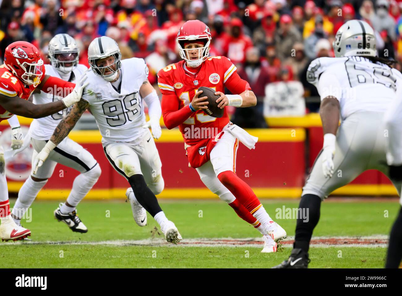 Kansas City Chiefs quarterback Patrick Mahomes (15) scrambles awary ...