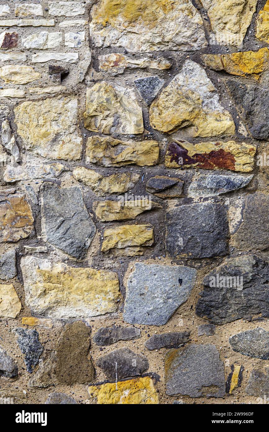 Stone cladding with an aged rustic look is created by old rustic bricks ...
