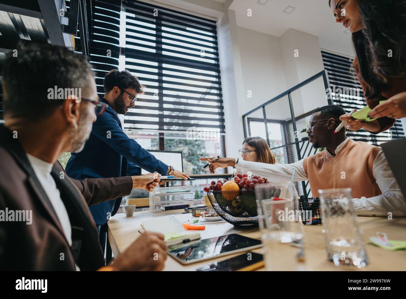 Diverse business team collaborating on projects, sharing ideas and ...