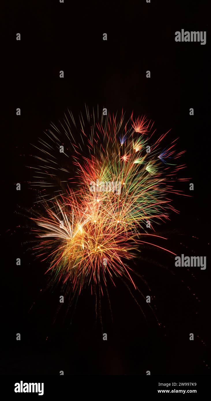 A beautiful night sky illuminated by bright colorful fireworks Stock ...