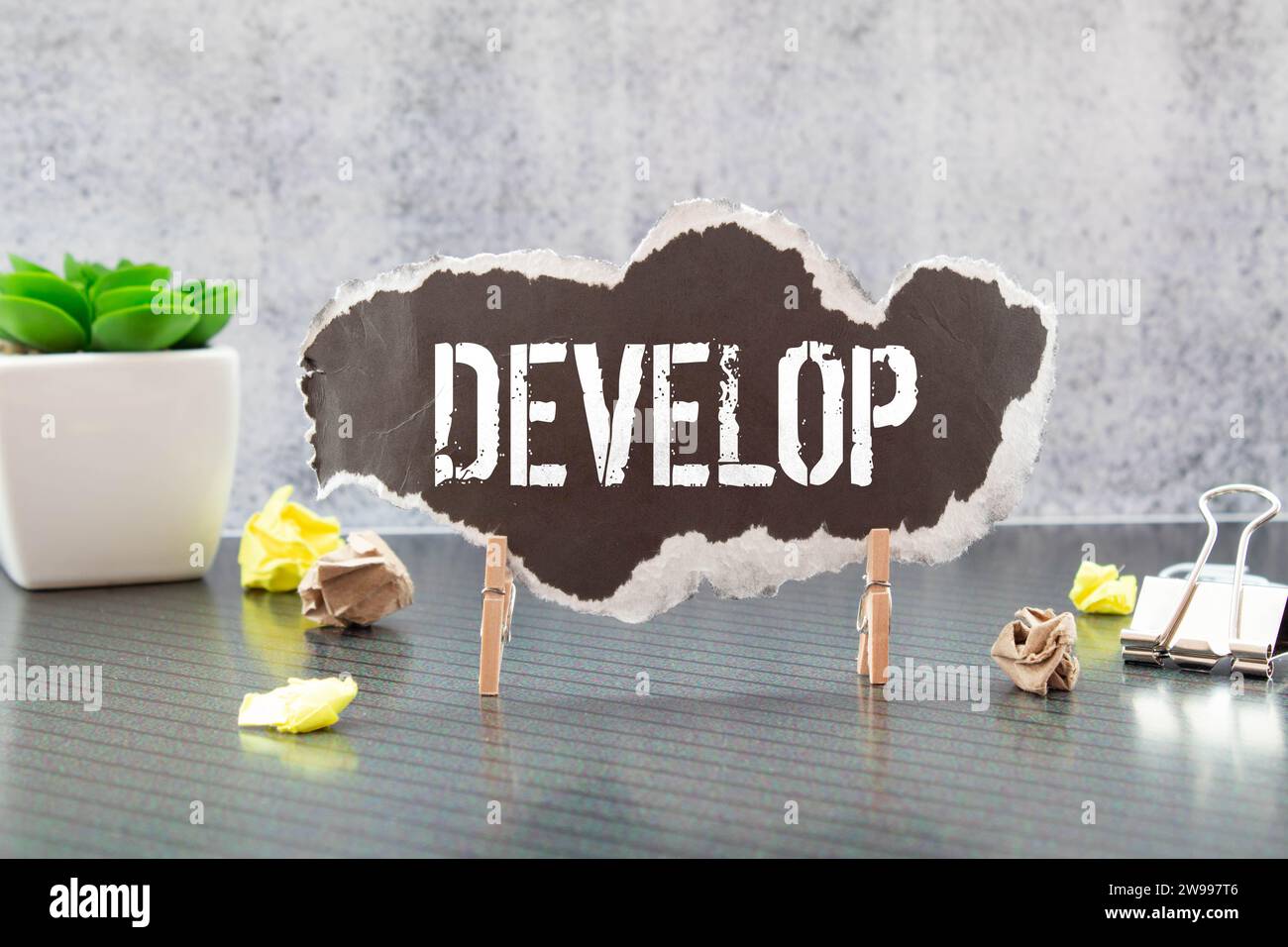 Develop word written on wood block. Develop text on cement table for ...