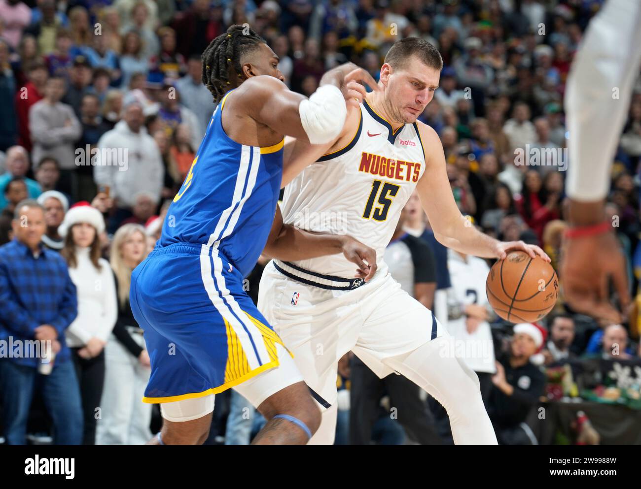 Denver Nuggets center Nikola Jokic, right, drives past Golden State ...
