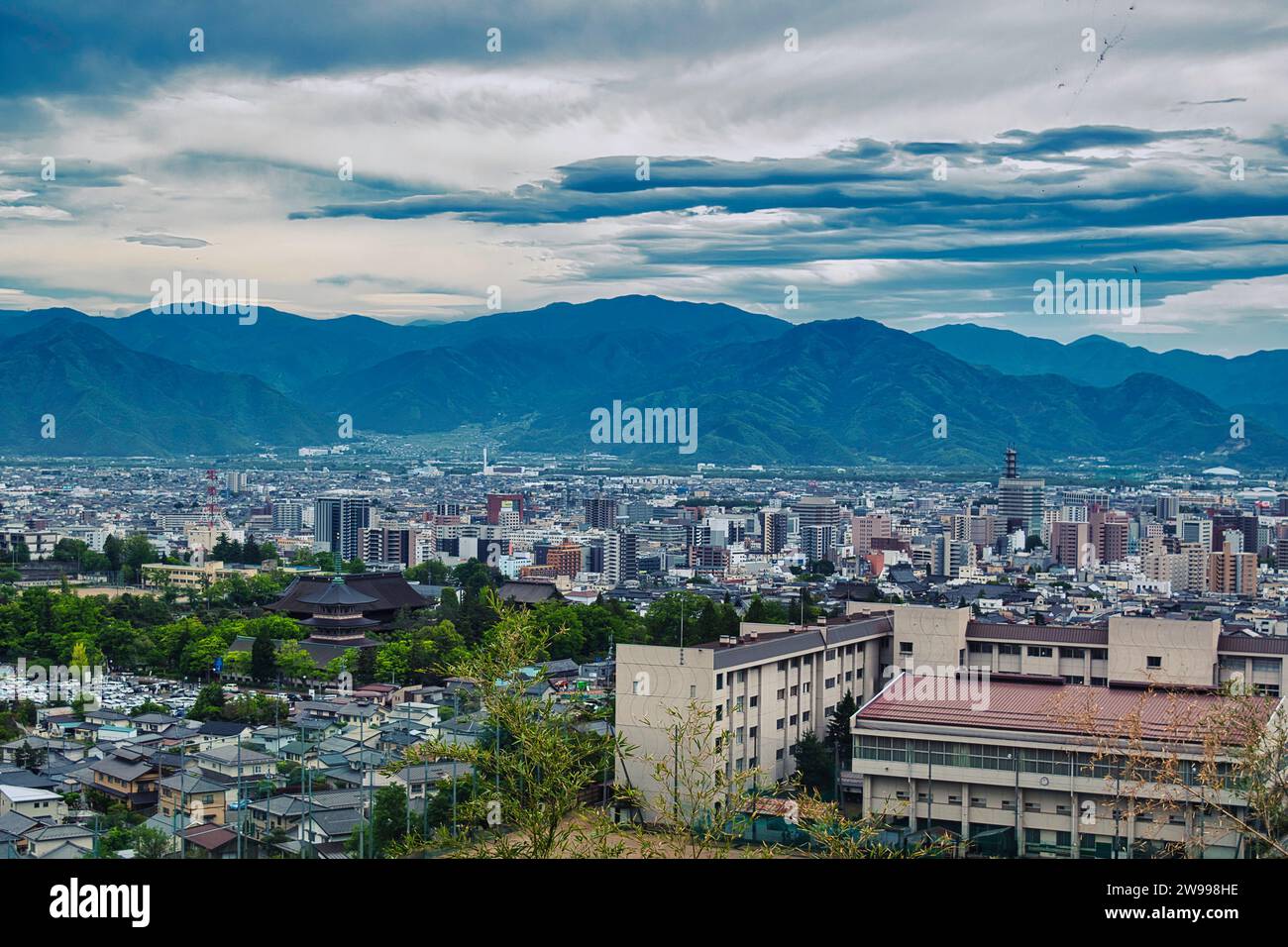 Photo of a view of Nagano city from the surrounding mountains. View the ...
