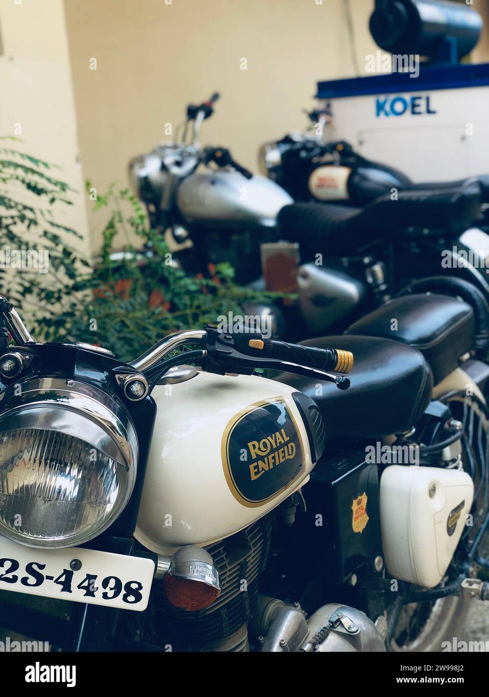 A row of three BULLET of Royal Enfield motorcycles, two of them are ...