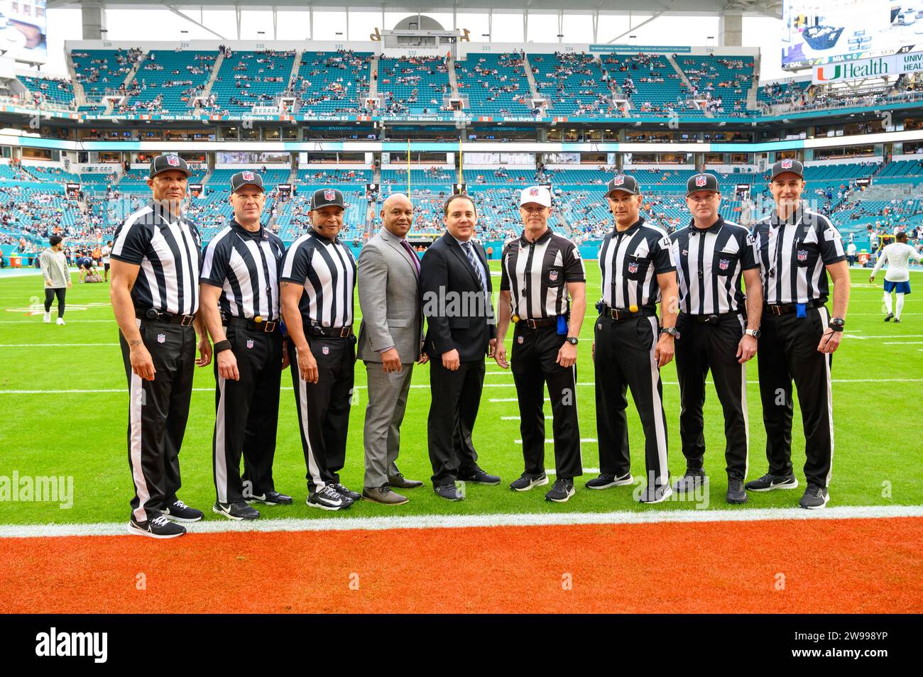 From left, NFL umpire Terry Killens Jr., back judge Rich Martinez, down ...