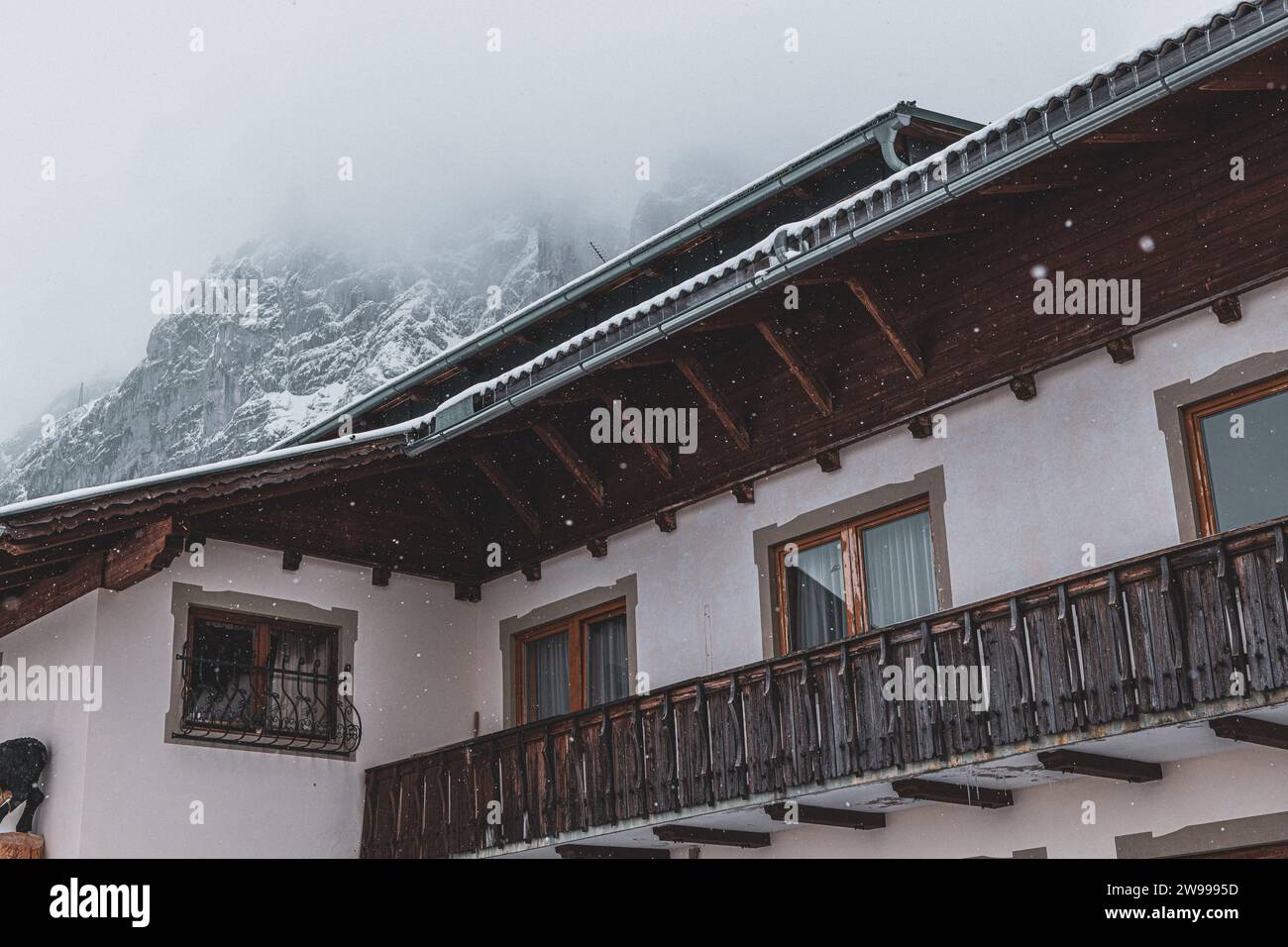 A scenic view of Bavarian Alps buildings in Germany against a dramatic ...