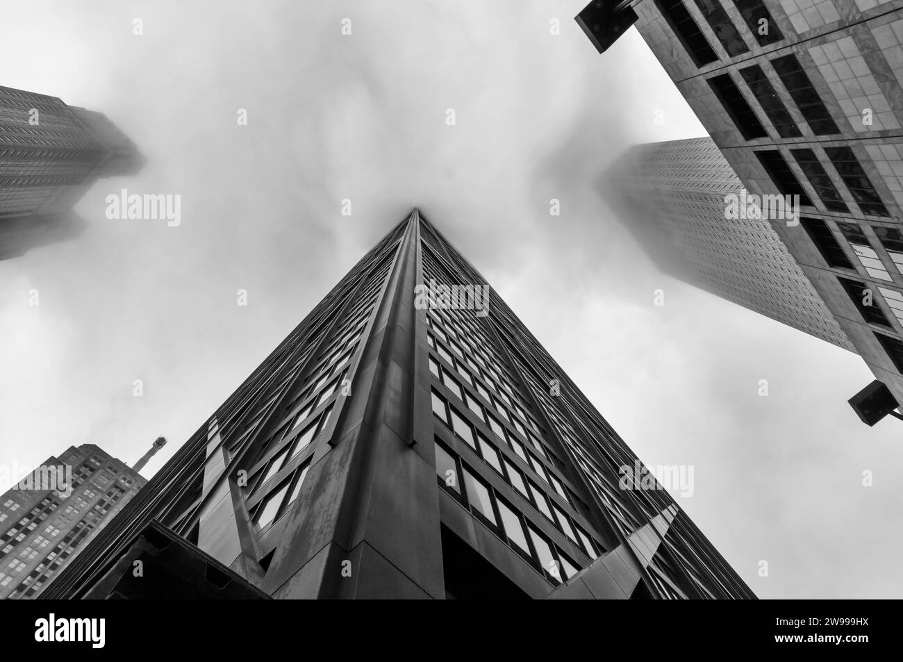 A low angle of John Hancock Building in Chicago, Illinois in grayscale ...