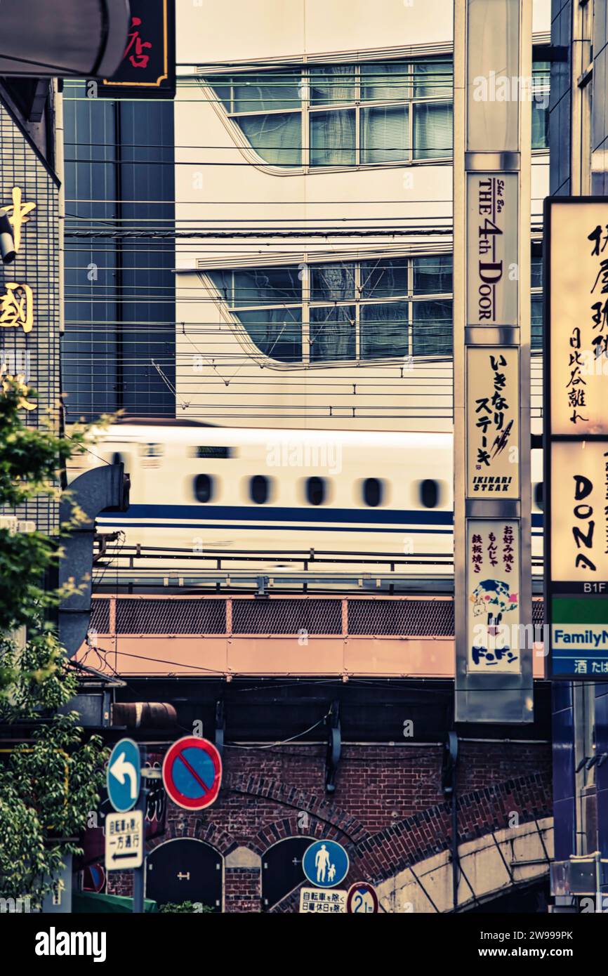 the street of Tokyo in Shinbashi old business district with the bullet ...