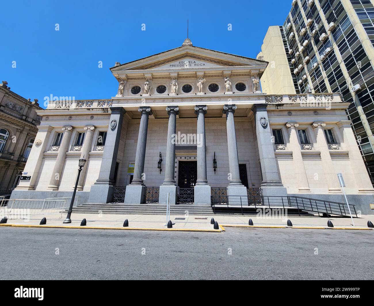 An impressive white stone structure with grand columns and ornate ...