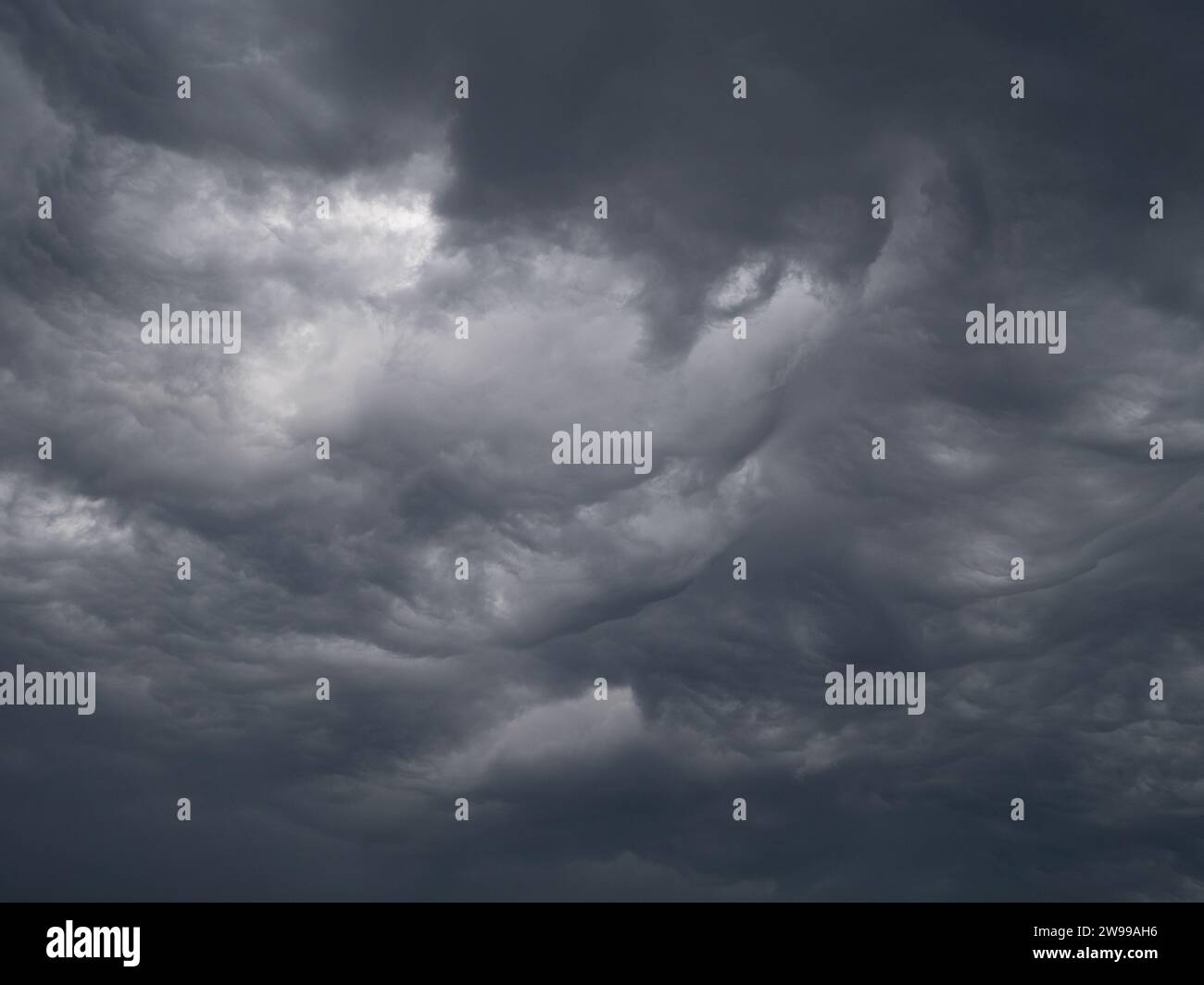 A stunning view of a cloudy sky with thick formations of clouds Stock ...