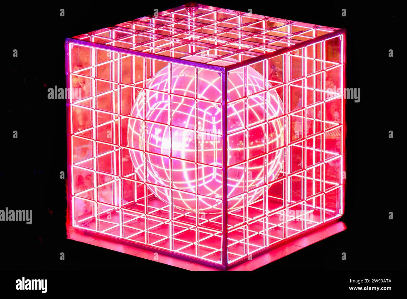 A 3D illustration of an abstract futuristic light cube with a pink hue ...