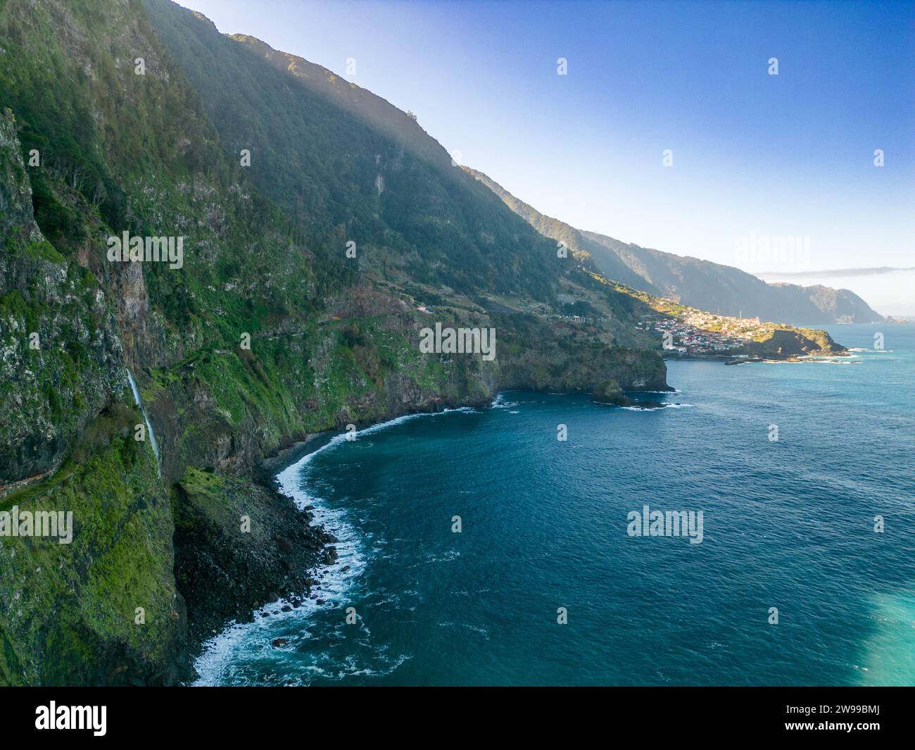 A stunning coastal landscape, featuring cliffs and tranquil blue waters ...