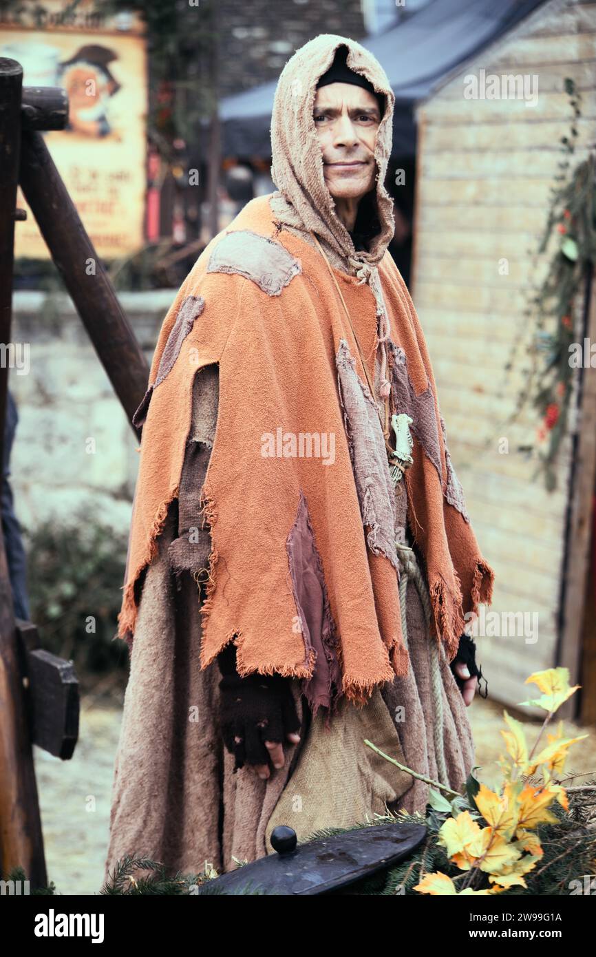 A human figure dressed in costume standing outside amidst a vibrant ...