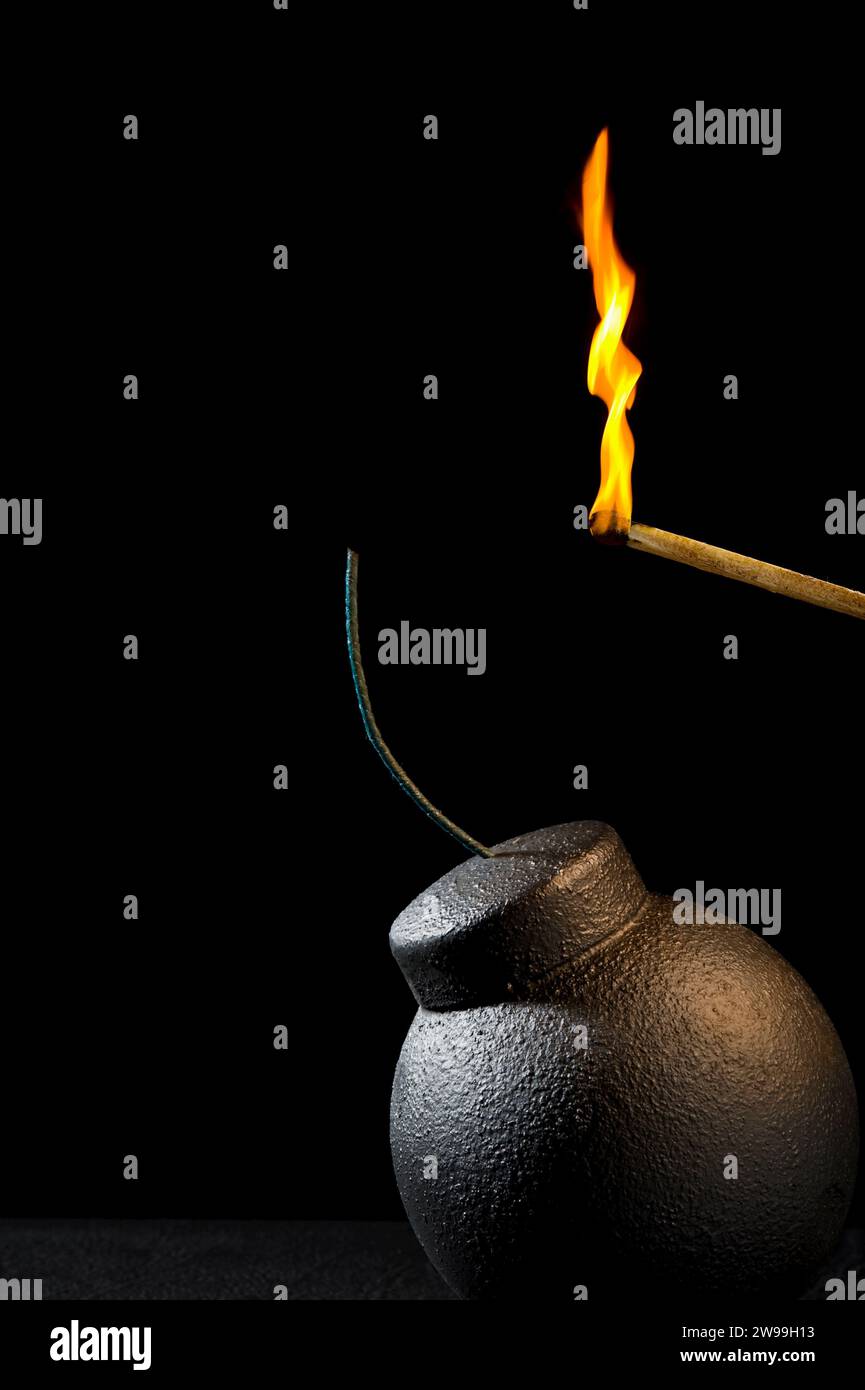 A matching lighting fuse of an old vintage round cast iron ...