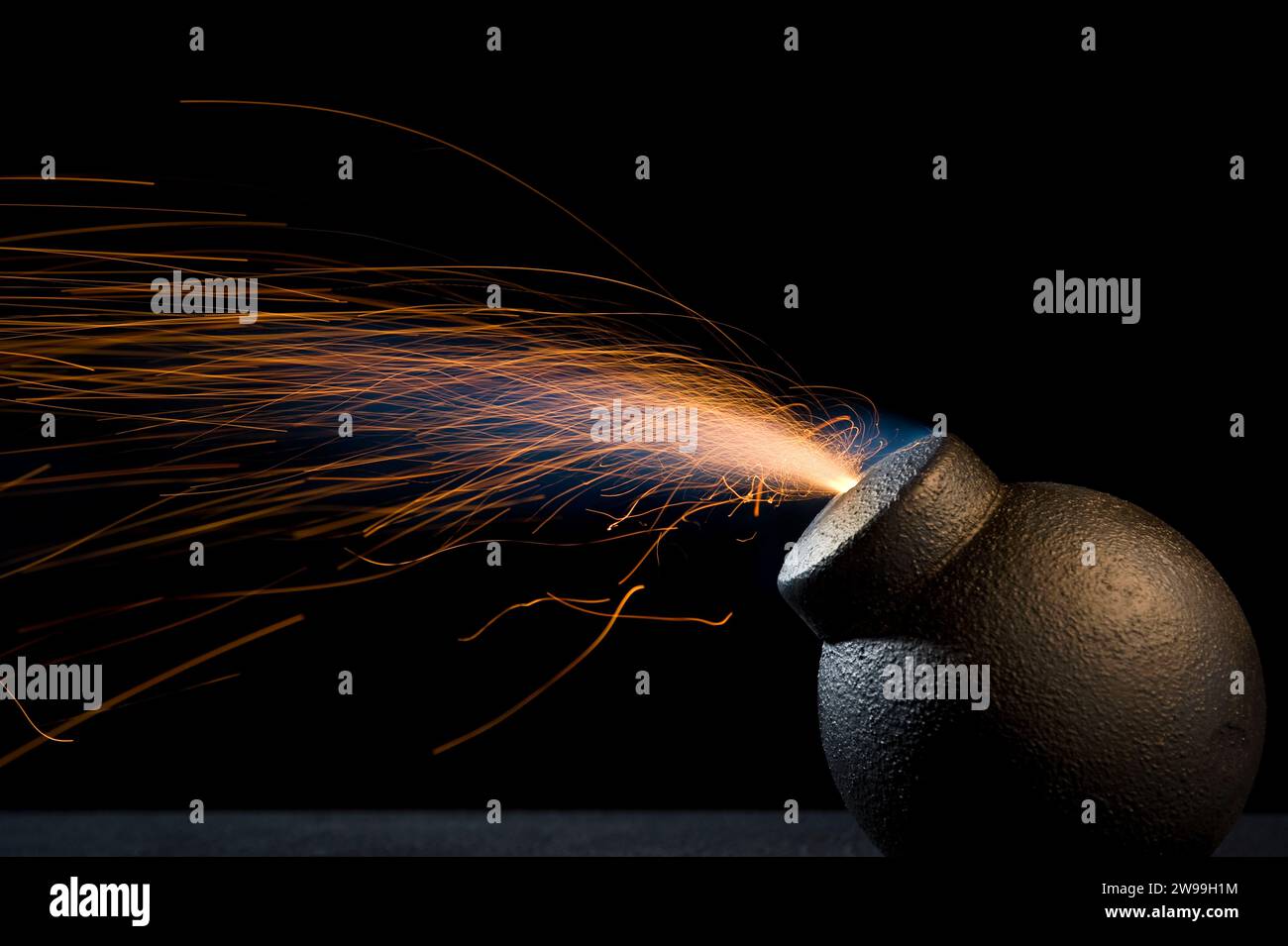 An old vintage round cast iron fragmentation bomb at the end of its ...