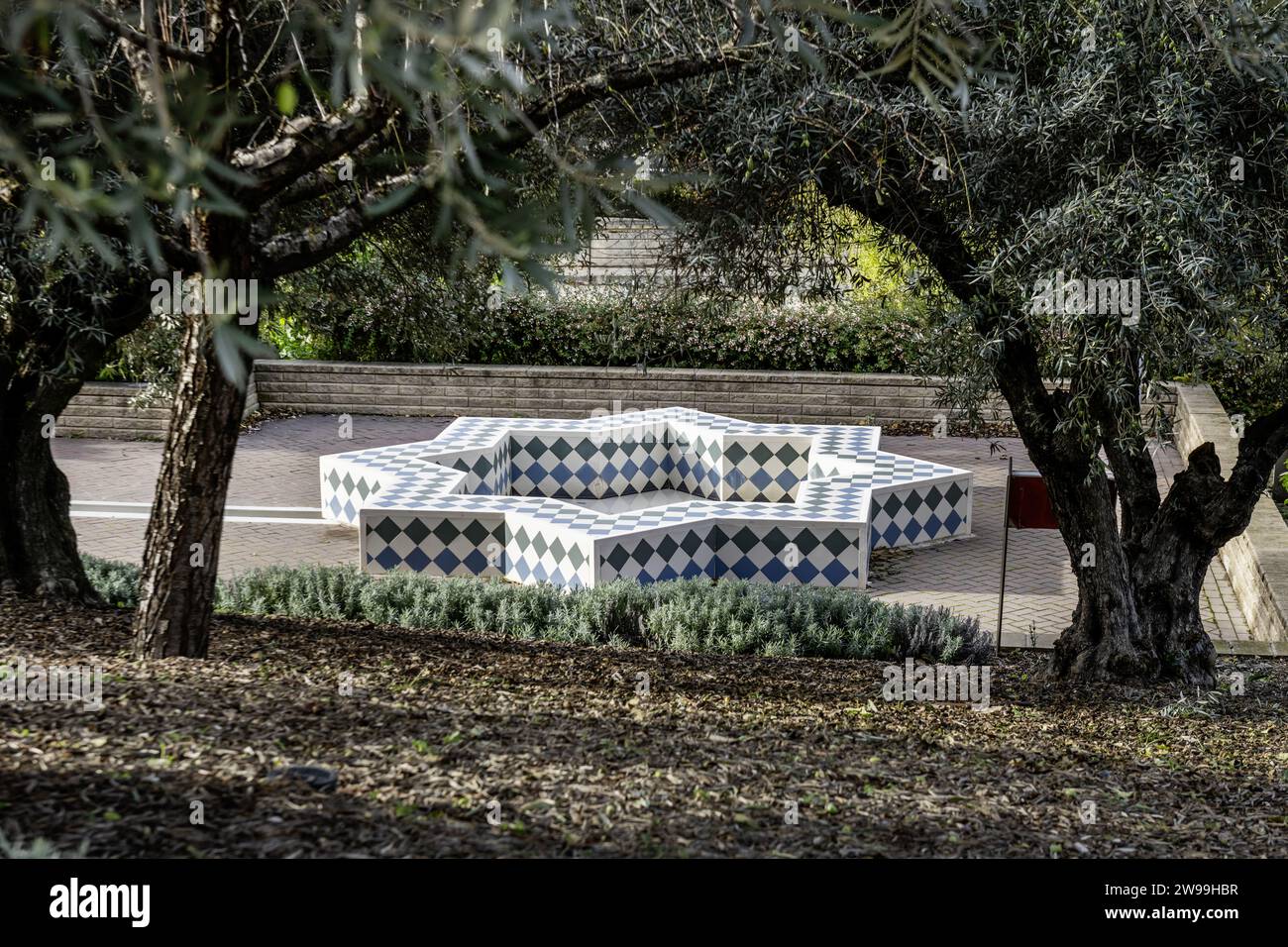 An urban park with a small Muslim-style star-shaped pool Stock Photo ...