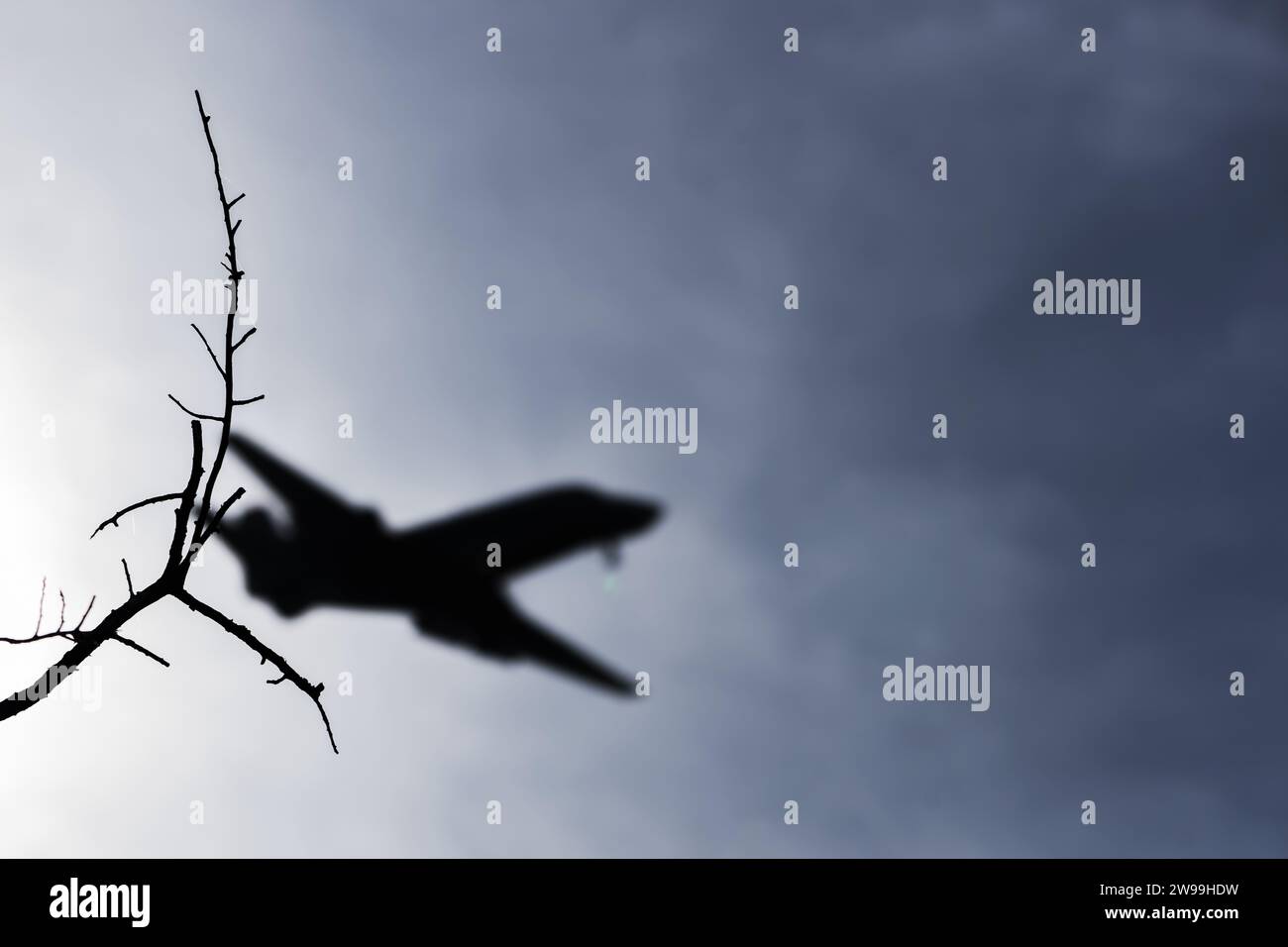 Shadow against light of a small aircraft in flight Stock Photo - Alamy