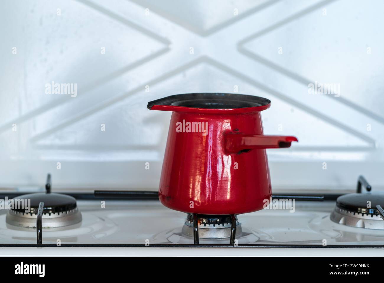 Red Cezve. Traditional pot for cooking turksih coffee. Against white ...