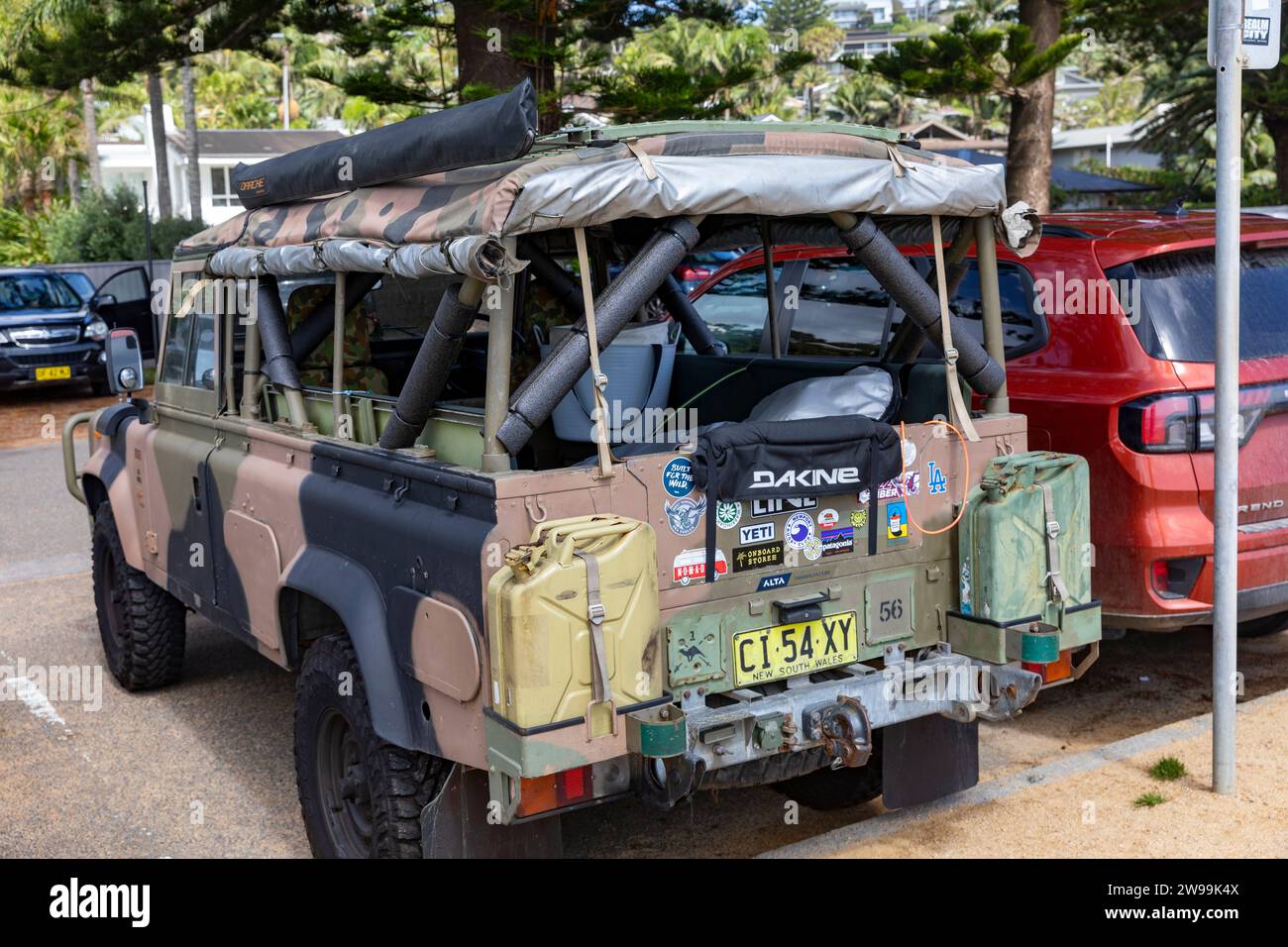1989 model Land Rover Defender in army camouflage colours parked at ...