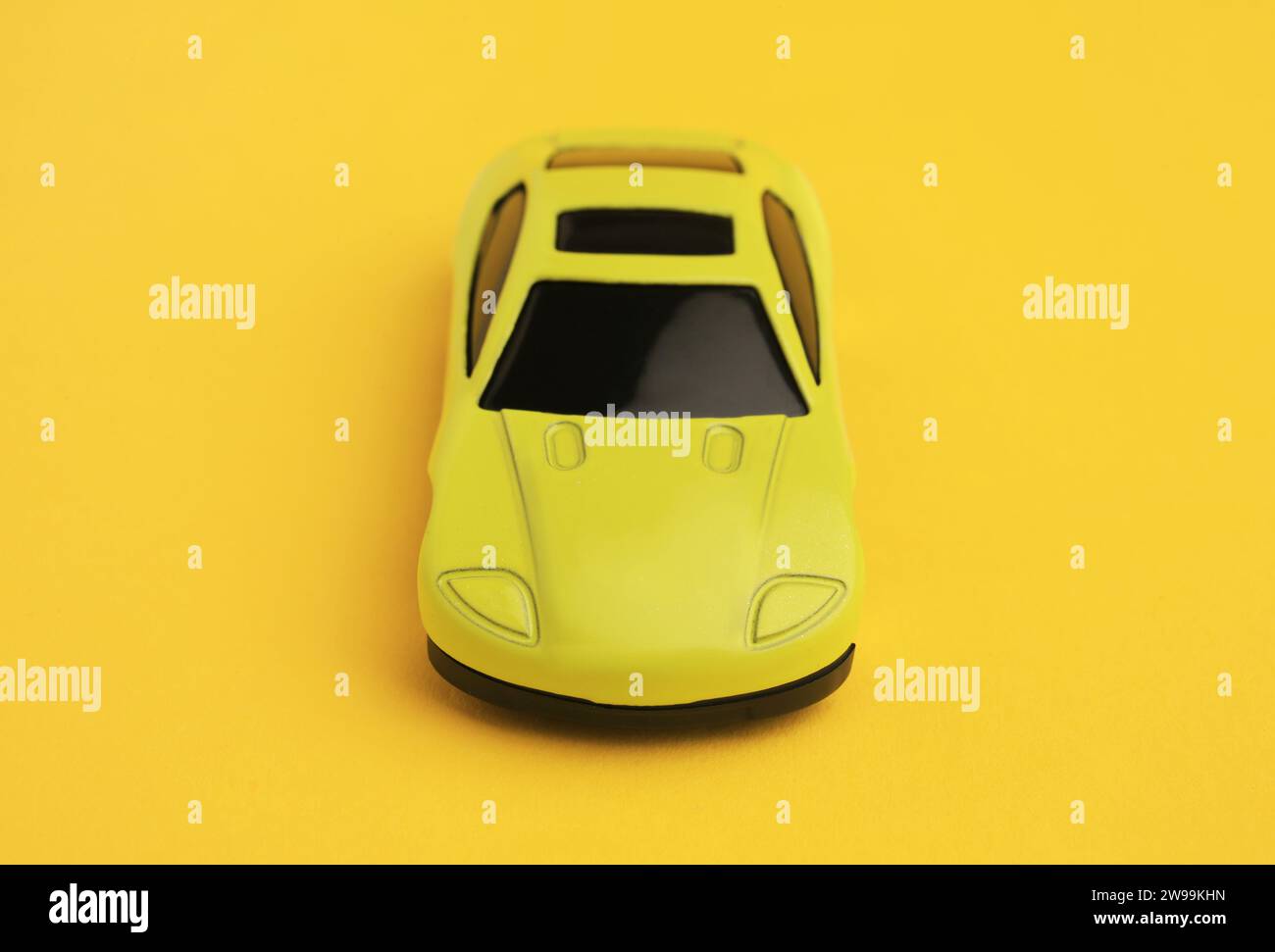 One bright car on yellow background. Children`s toy Stock Photo - Alamy