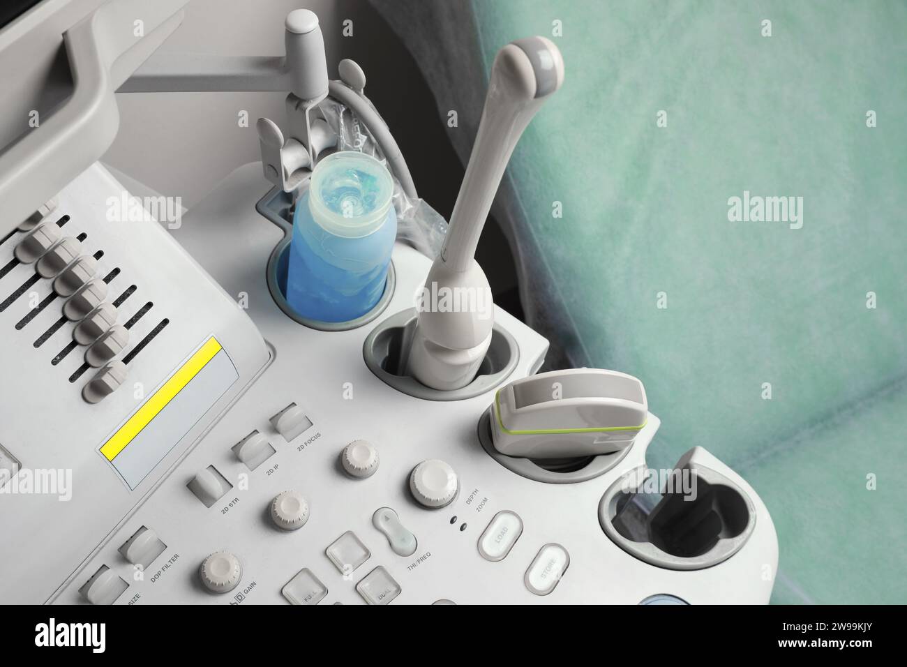 Ultrasound control panel and examination table in hospital, above view ...