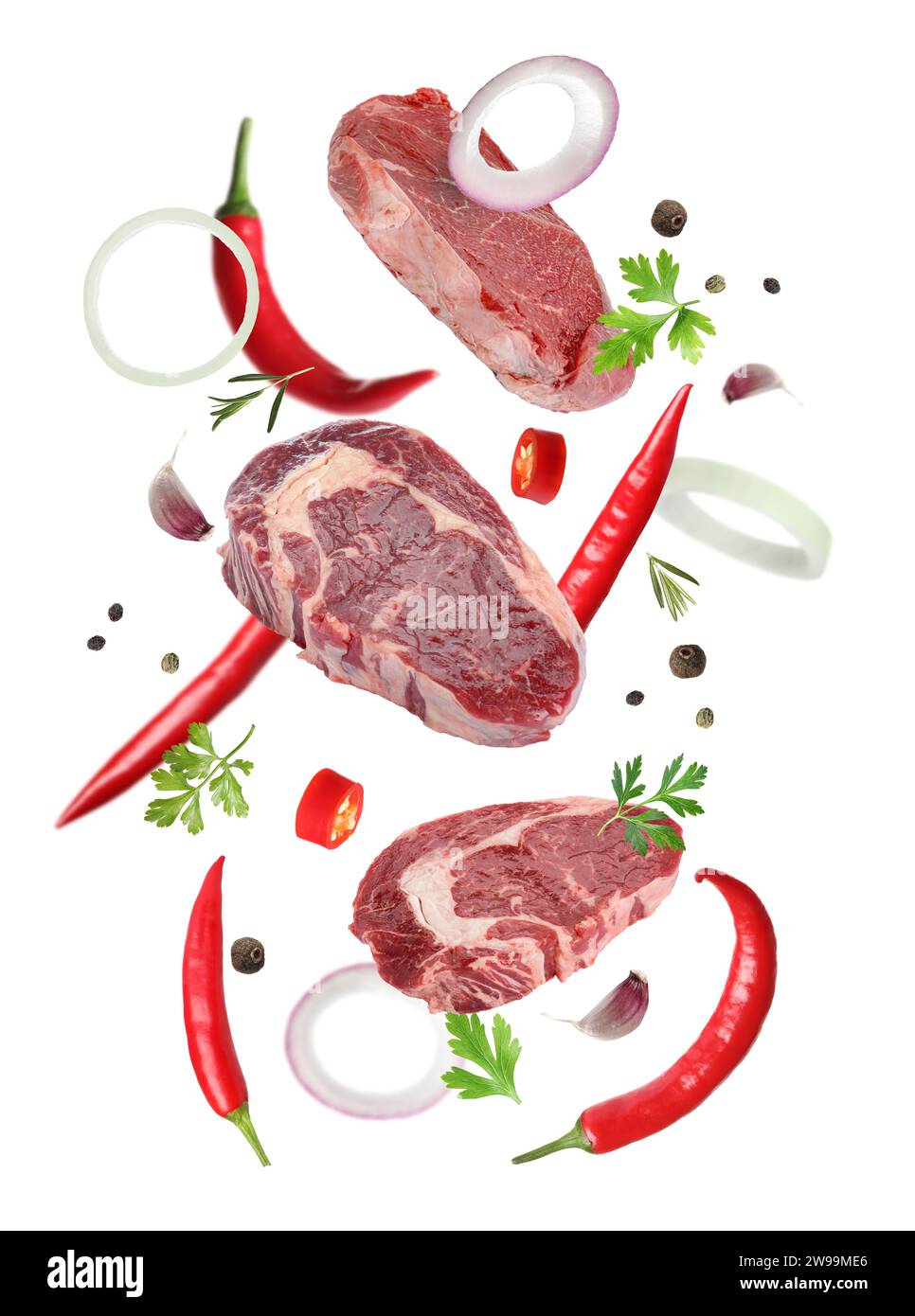 Beef meat and different spices falling on white background Stock Photo ...