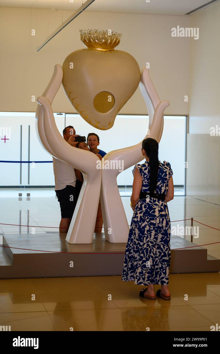 A sculpture with of the Most Sacred Heart of Jesus with mirrors on it ...