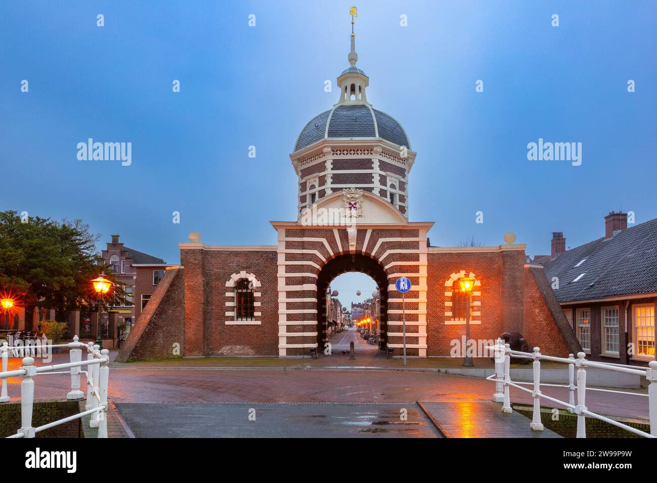 City gate and Bridge Morspoort in Leiden during blue hour, South ...