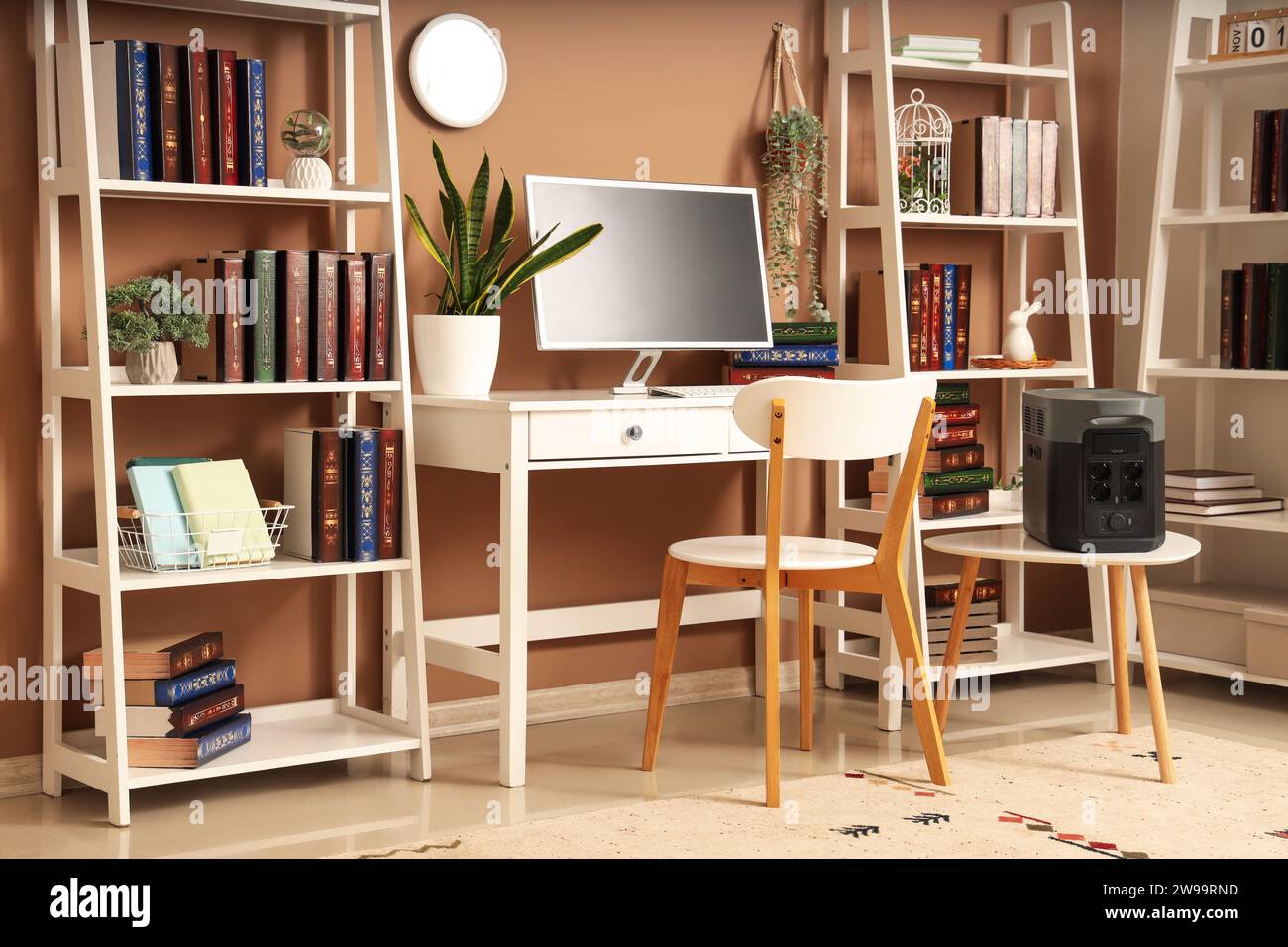 Interior of office with portable power station and workplace Stock ...