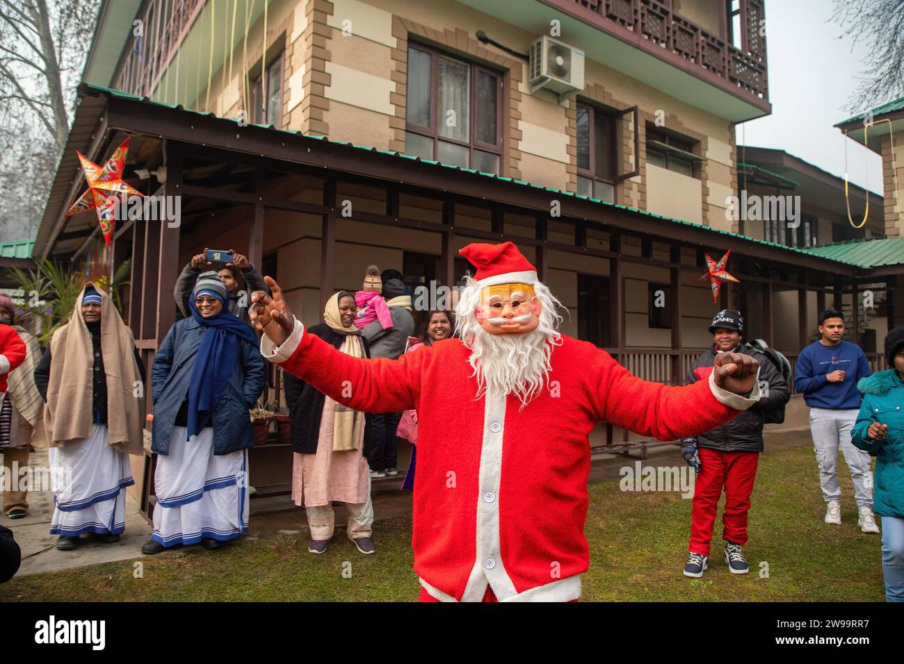 Srinagar, India. 25th Dec, 2023. Santa Claus dances outside the Holy ...